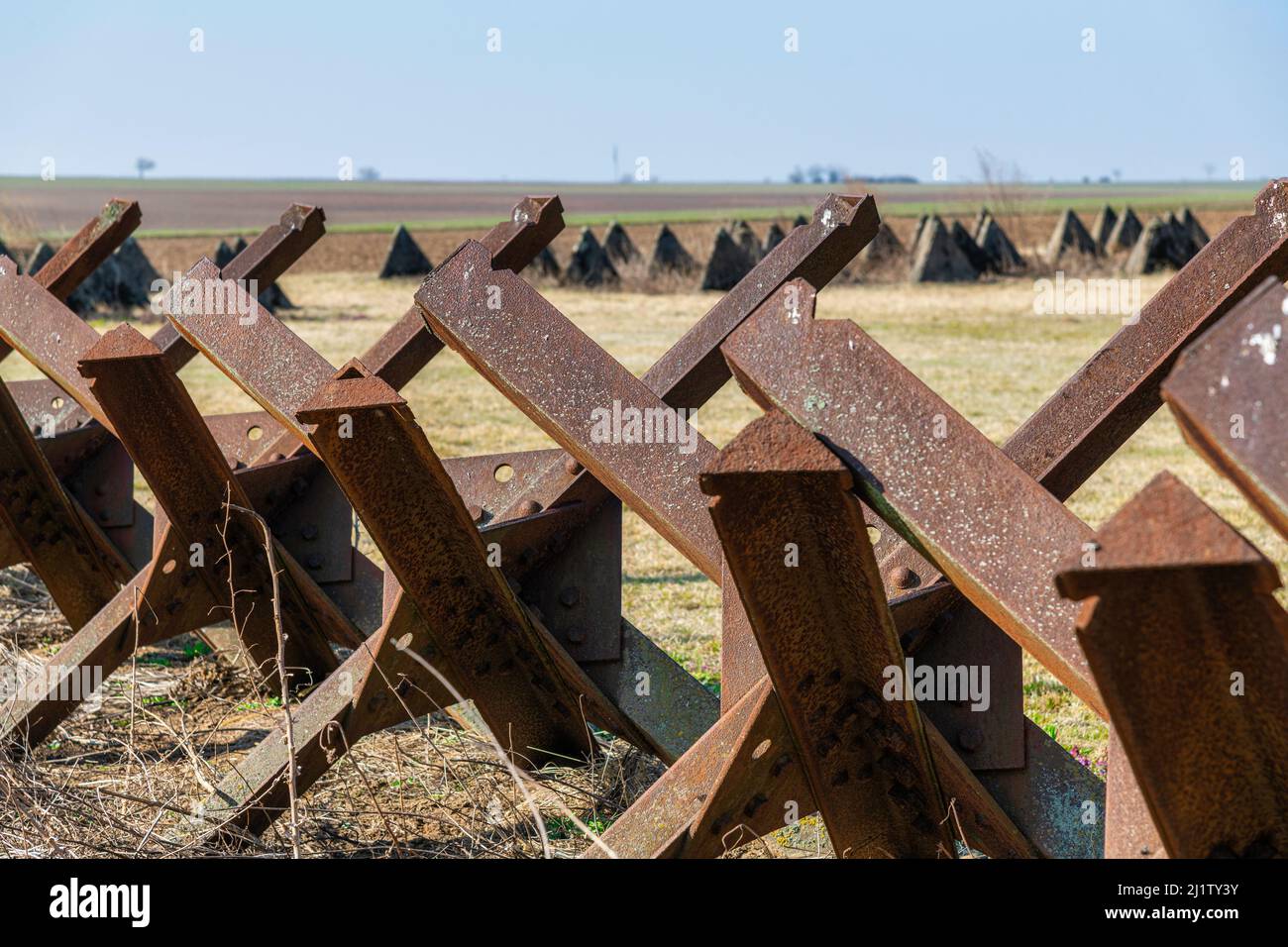 Old army road near Cizov village with roadblock and wires in national ...