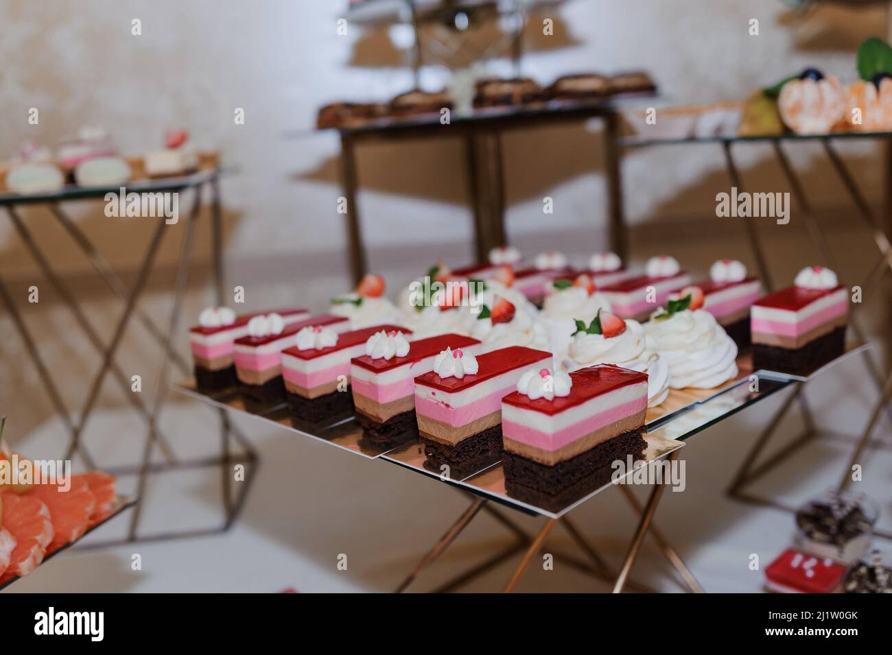 Sweet cakes at a wedding banquet. Catering, sweet festive buffet Stock ...