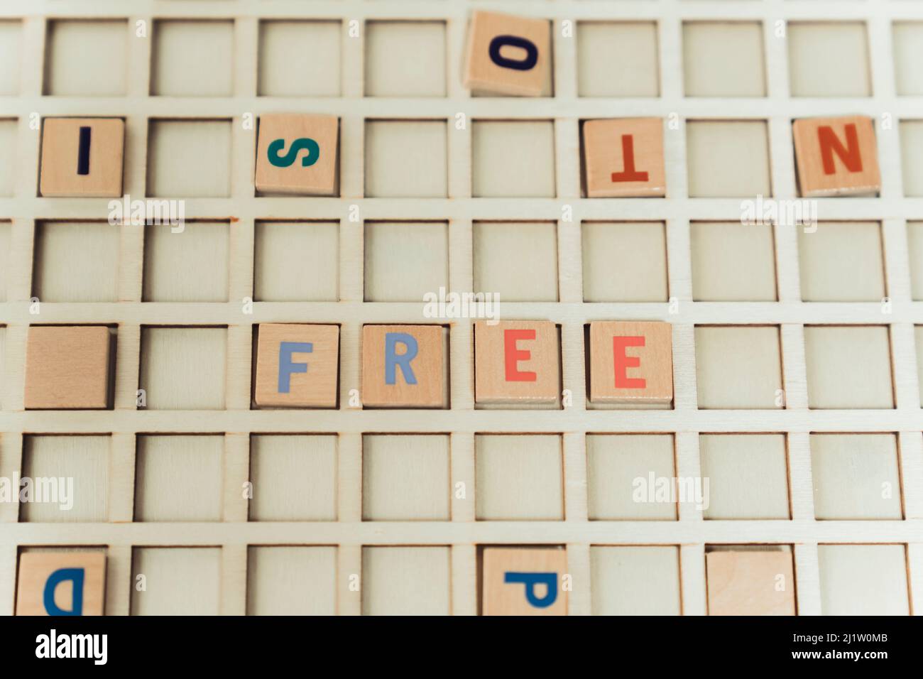 The word FREE made of wooden alphabet letters vocabulary game. High ...