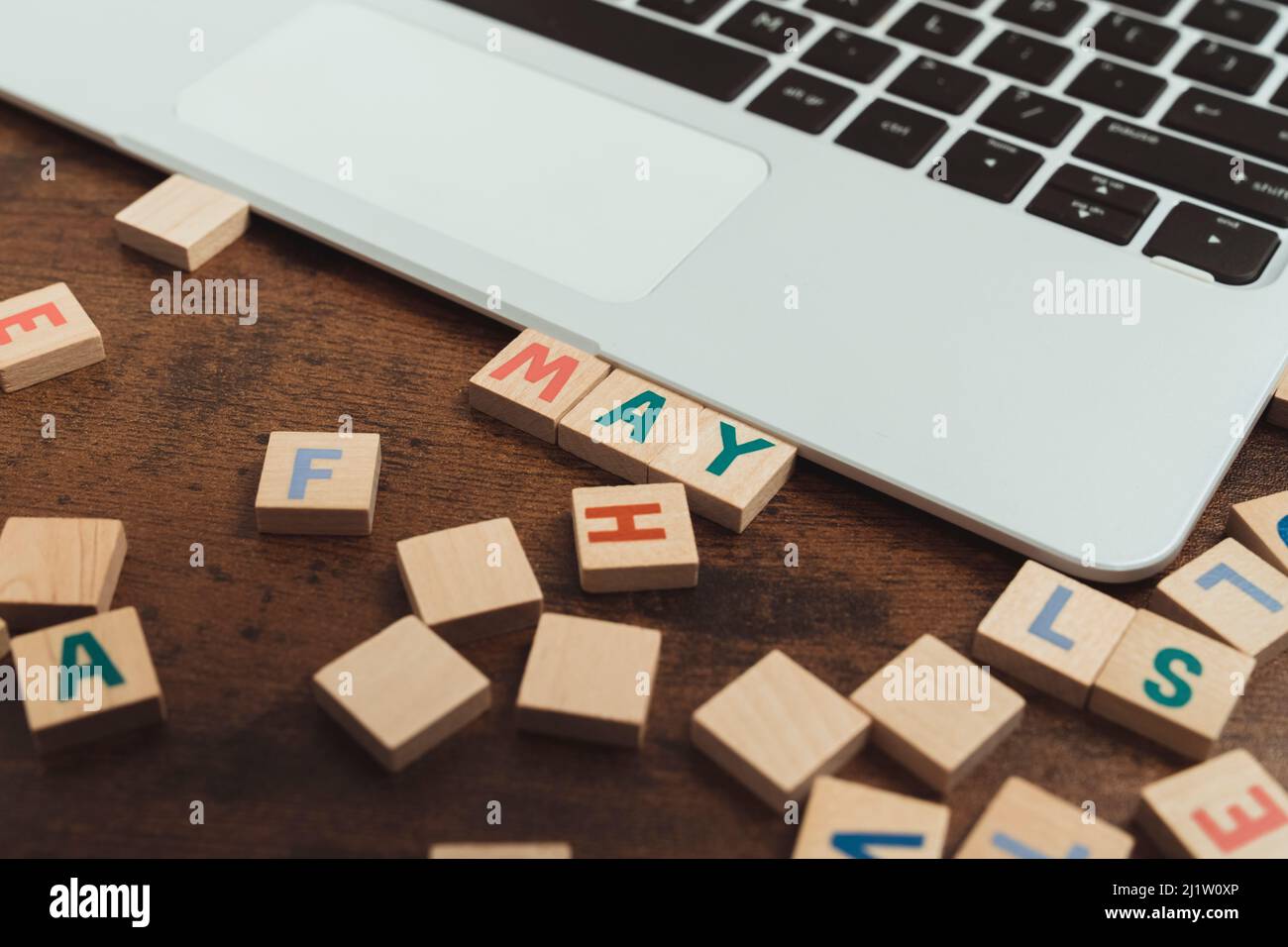 MAY word made of wooden alphabet letters working table background ...