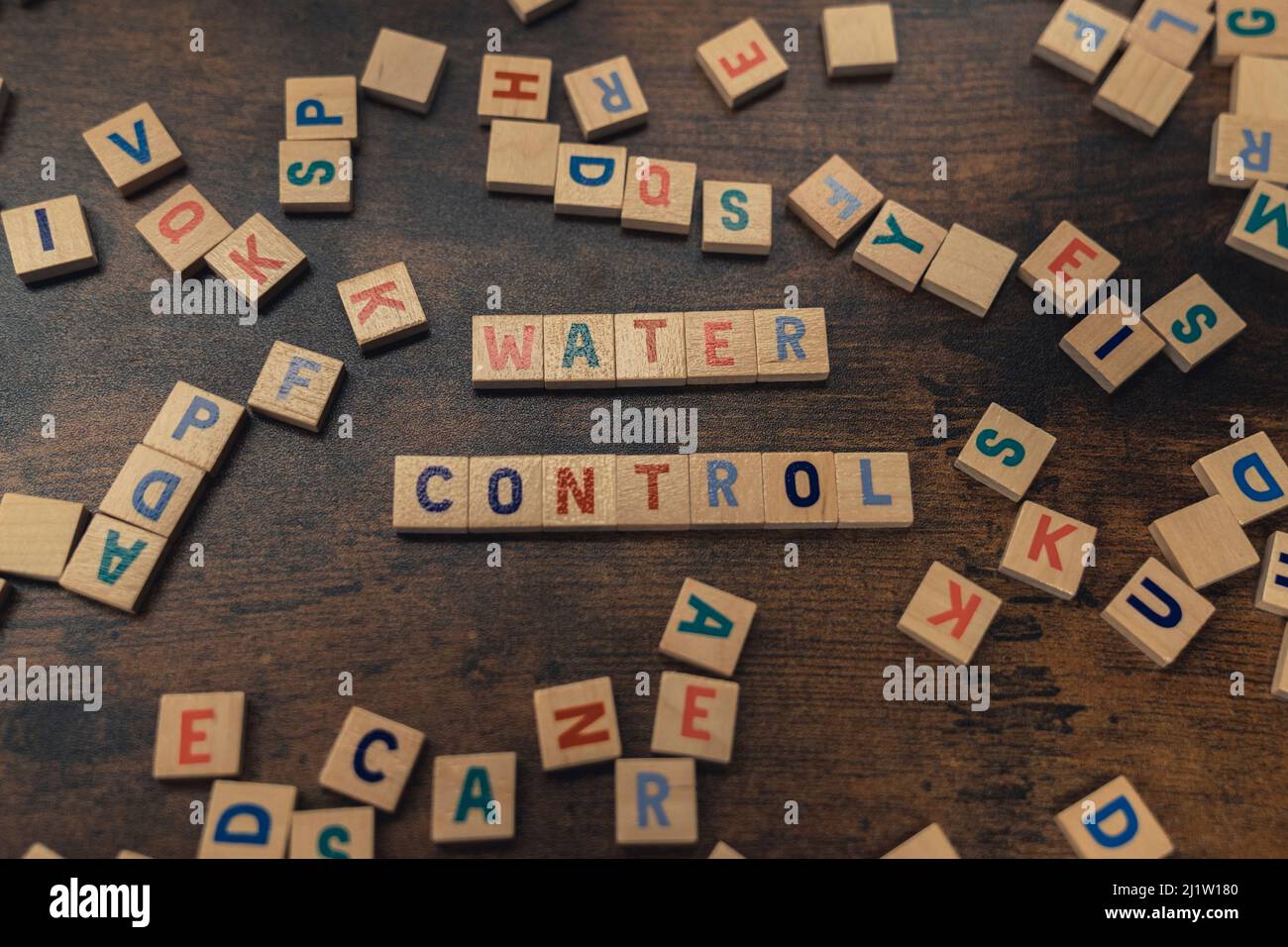A phrase WATER CONTROL made of aligned wooden letters environment ...