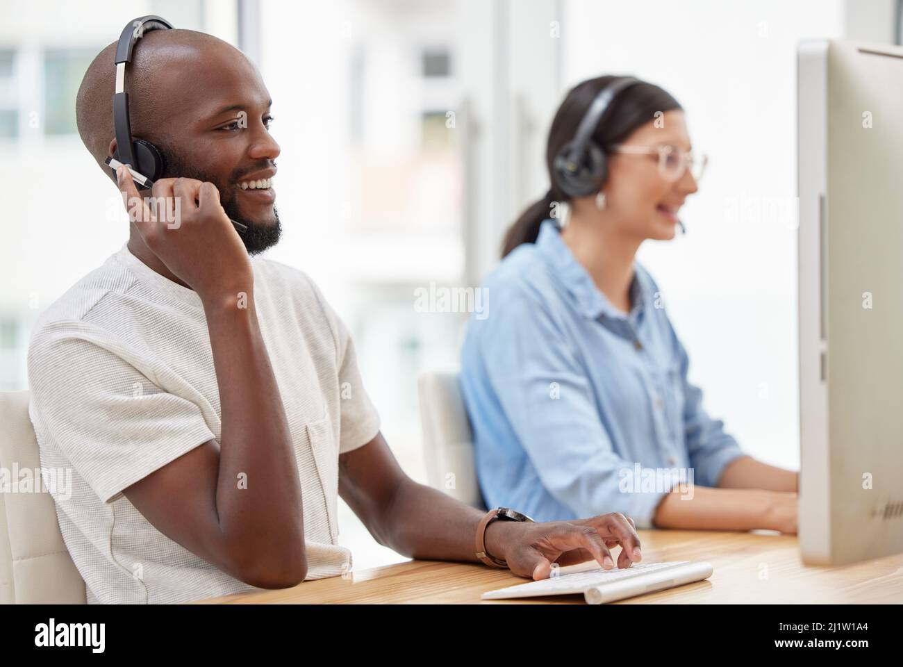 Male employee helping woman customer hi-res stock photography and ...