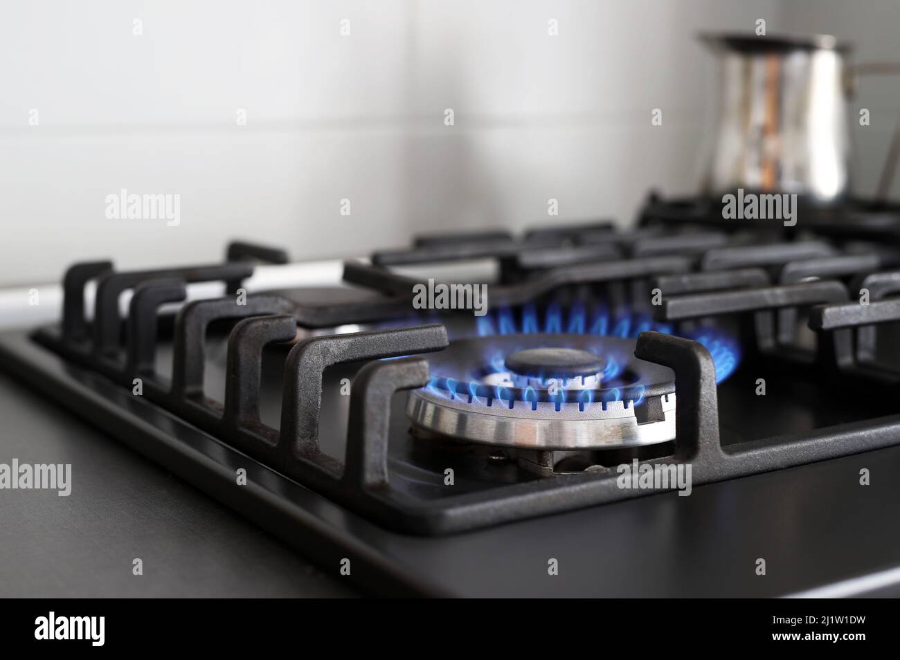 Close up of blue fire from the kitchen hob with propane gas. Stove. Gas ...
