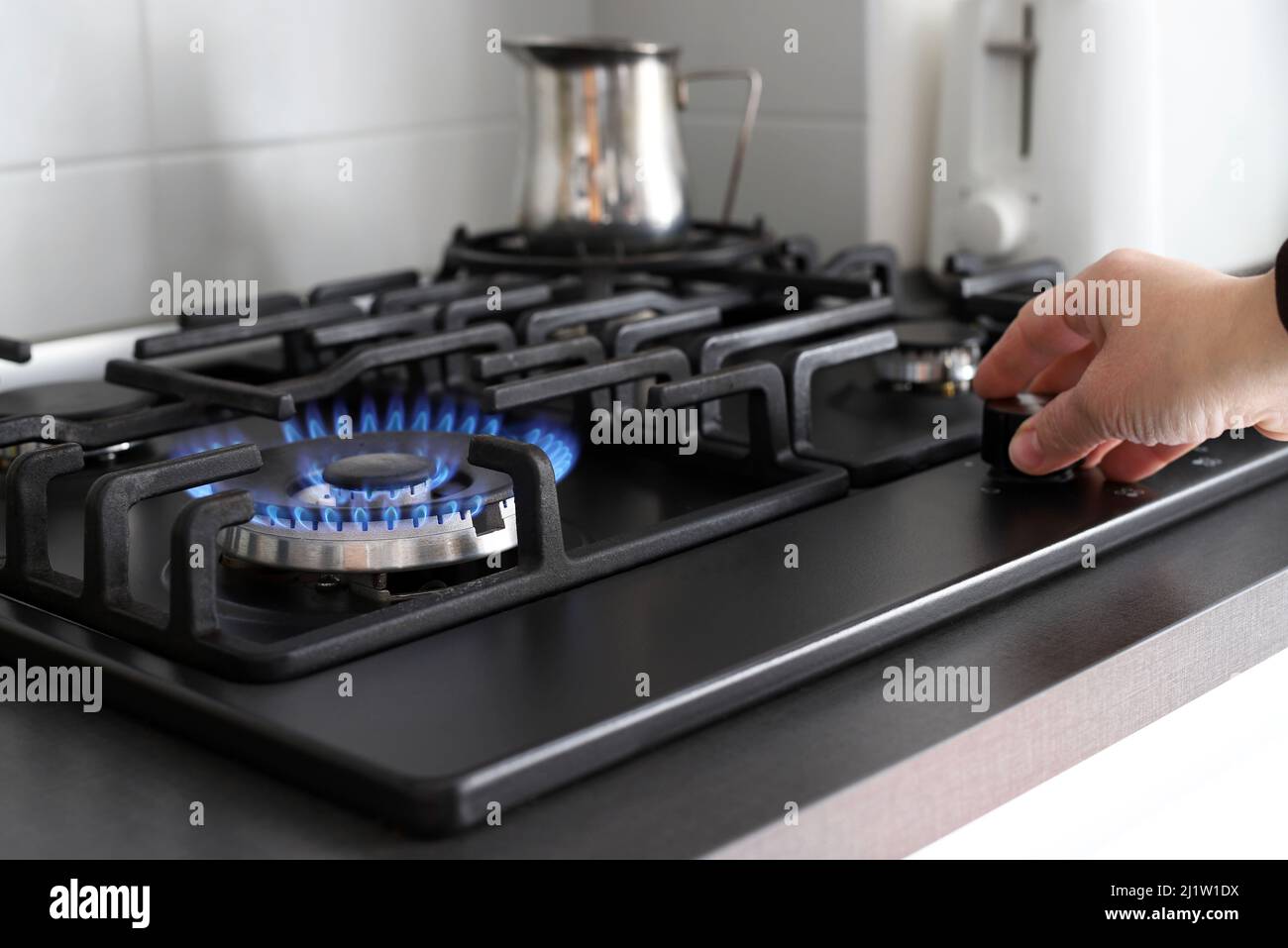 Close up of blue fire from the kitchen hob with propane gas. Stove. Gas ...
