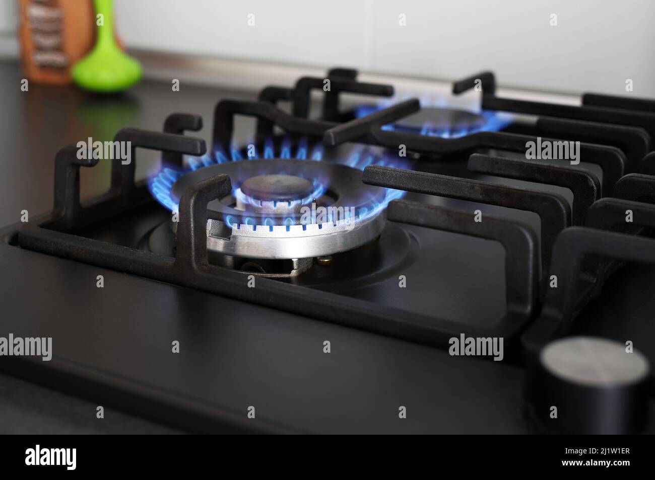 Close up of blue fire from the kitchen hob with propane gas. Stove. Gas ...