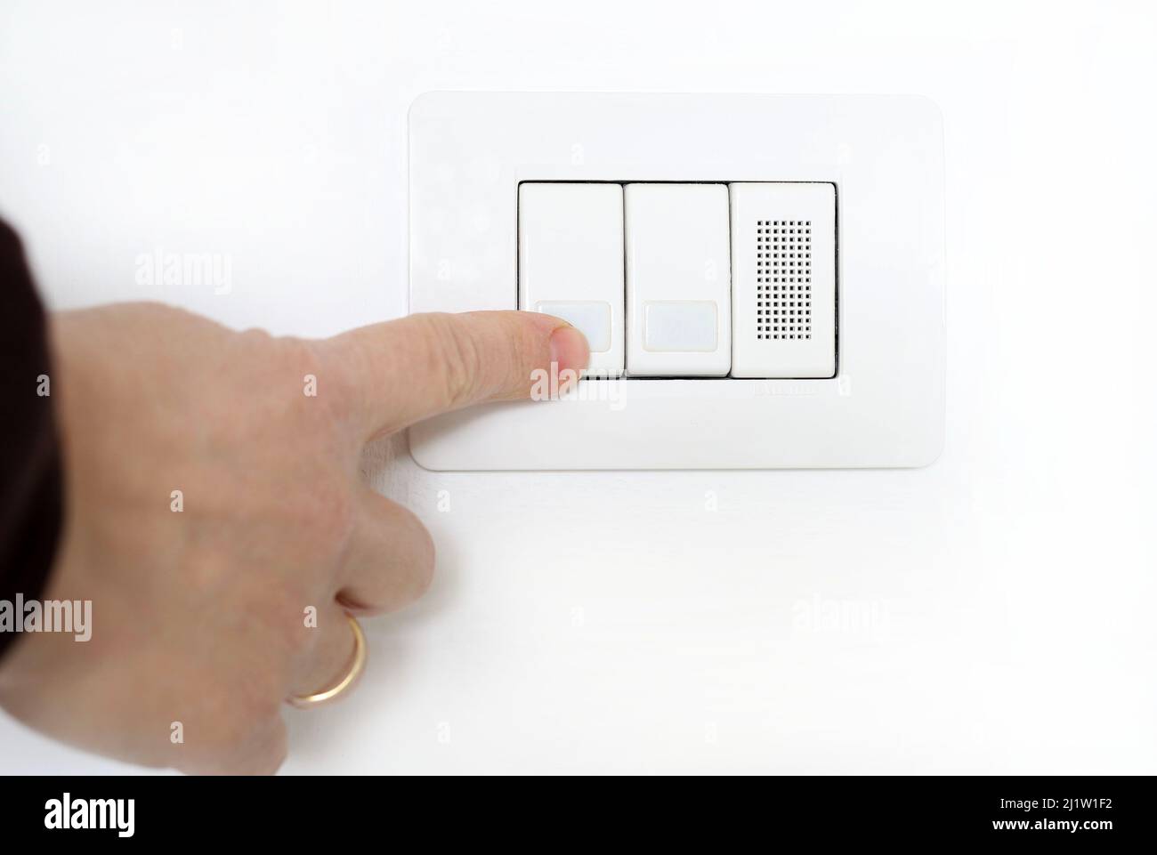 Energy saving light switch woman hi-res stock photography and images ...