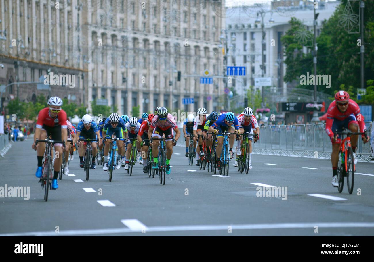 Group of cyclists crossing the start line. Cycle race among amateurs ...