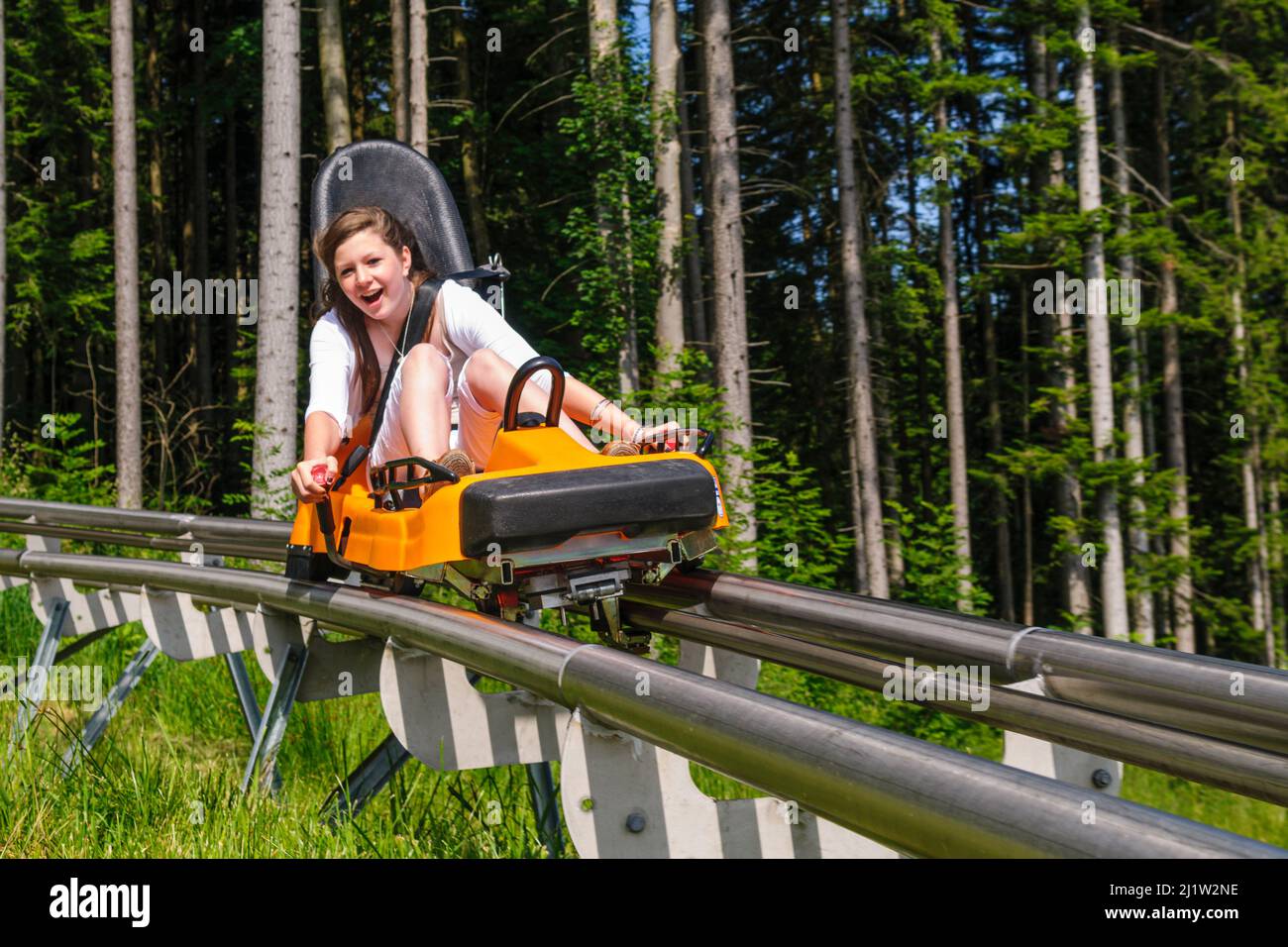 Young teenager on summer toboggan run Stock Photo - Alamy