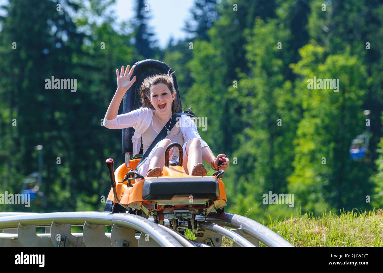 Young teenager on summer toboggan run Stock Photo - Alamy