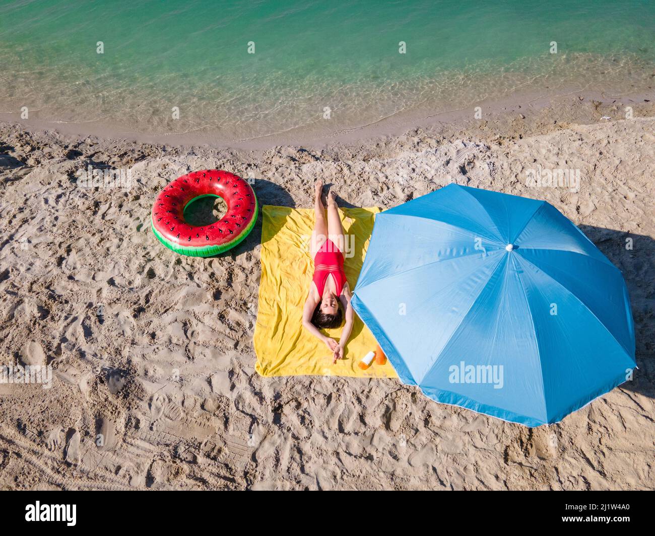 Summer beach stunning woman sunbathing hi-res stock photography and ...