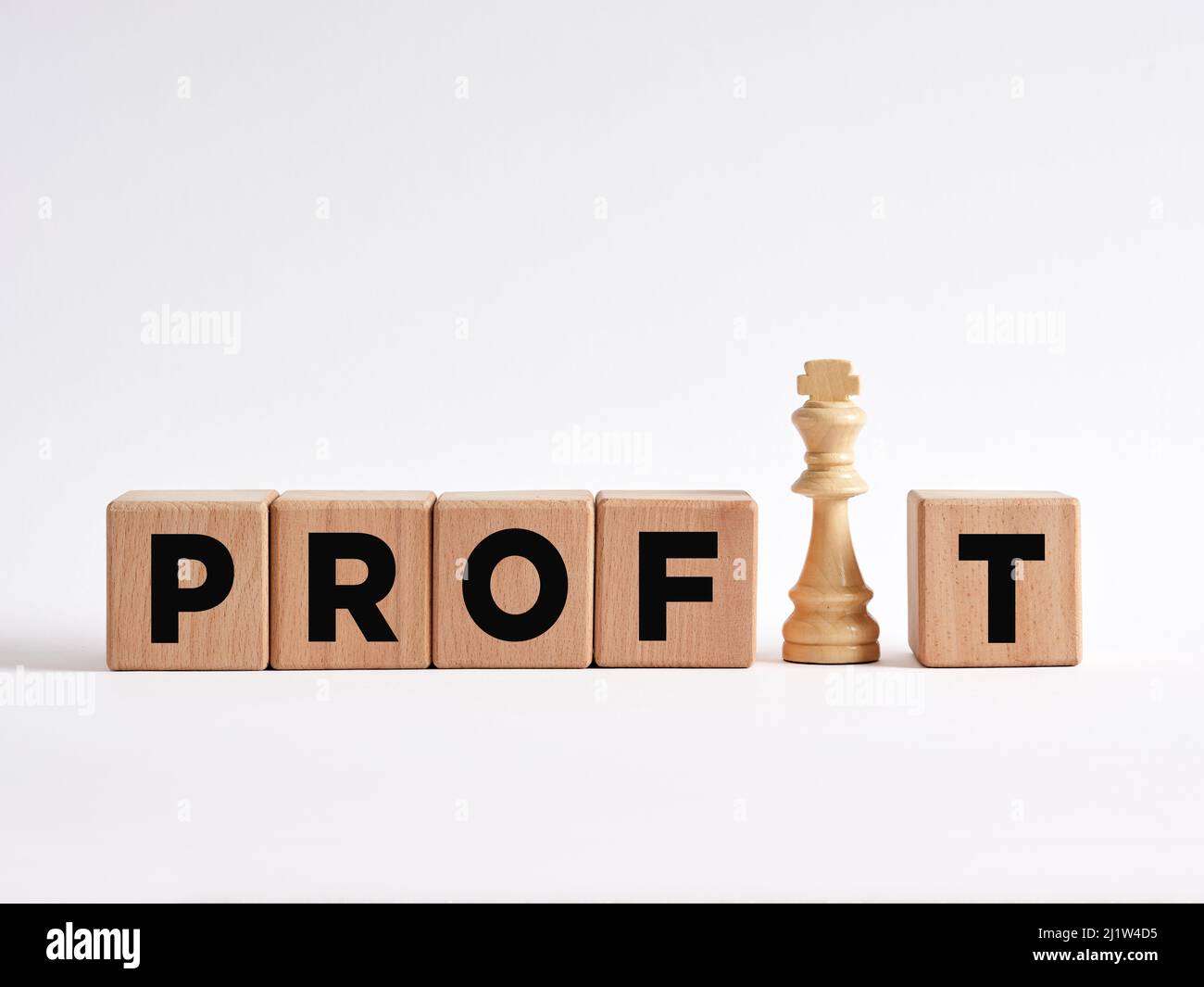 The word profit on wooden blocks with a king chess piece instead the ...