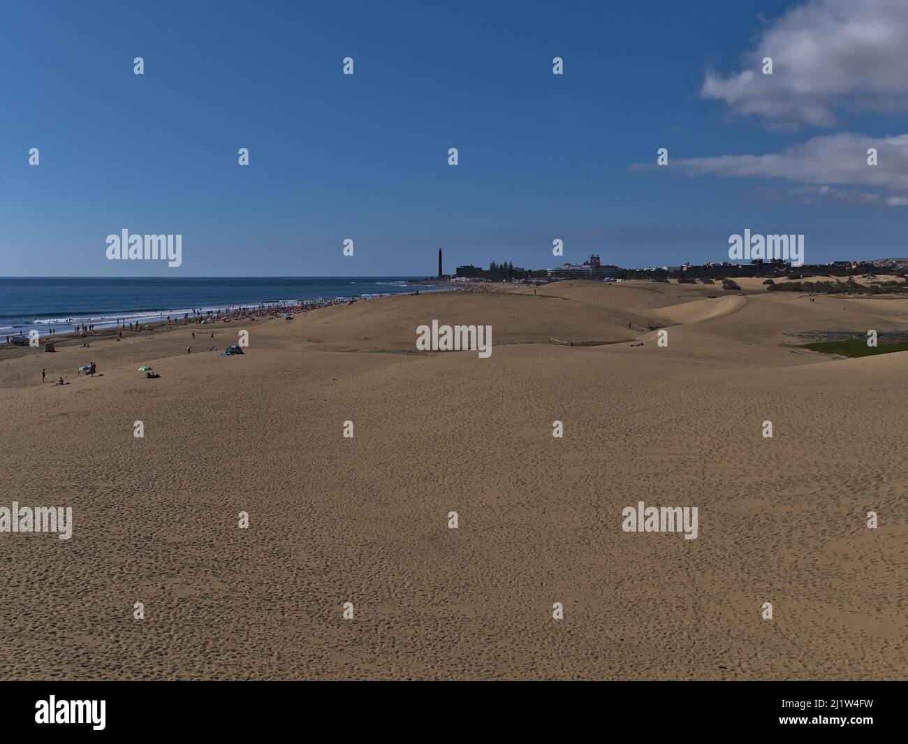 View over crowded beach Playa de Maspalomas with popular sand dunes and ...
