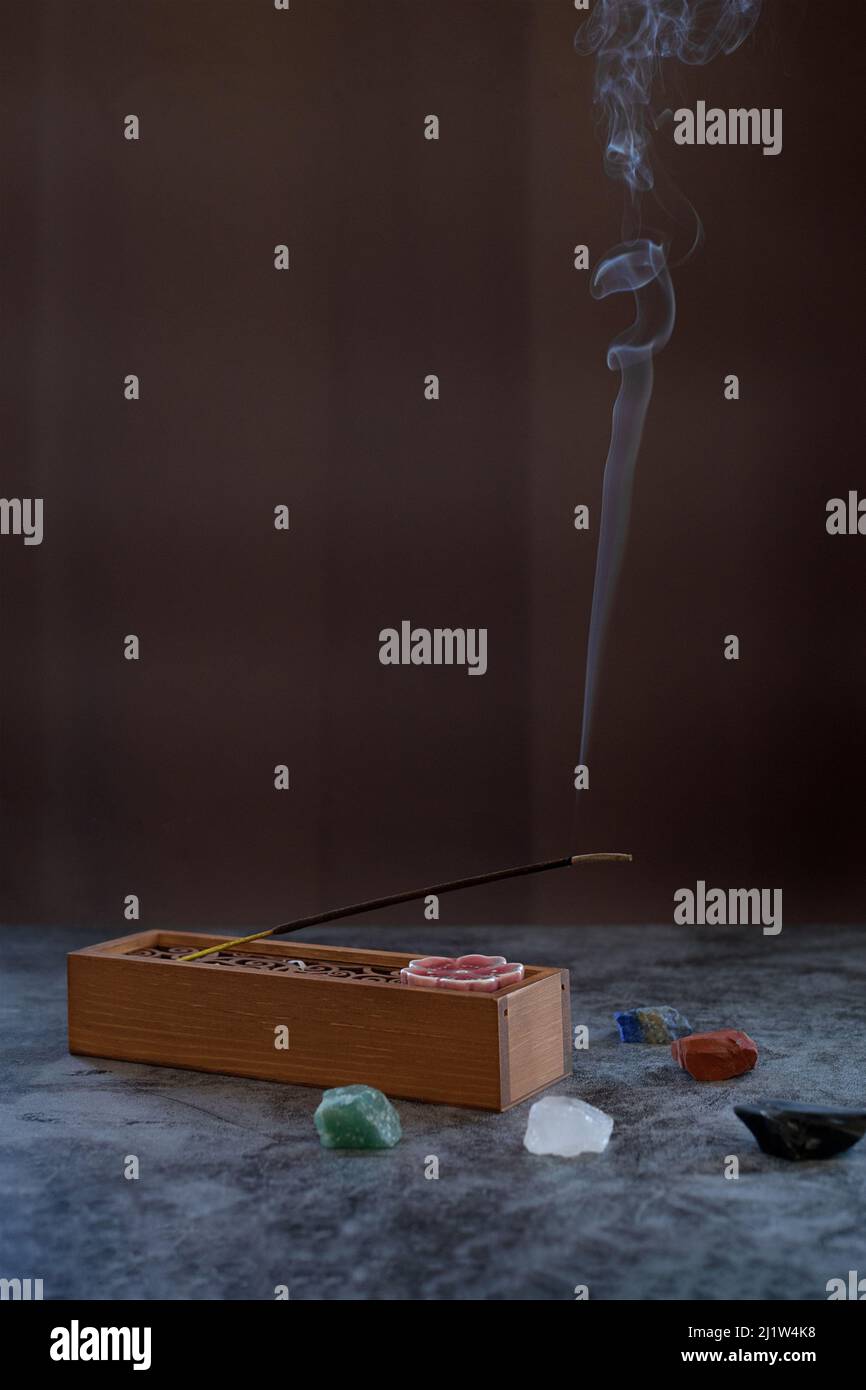 Burning aromatic incense smoke stick for meditation and relaxing with ...