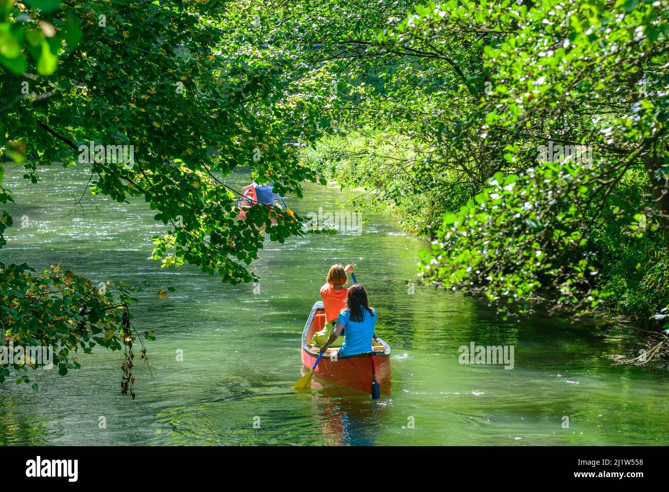 Two women navigating canoe on river in bavaria Stock Photo - Alamy