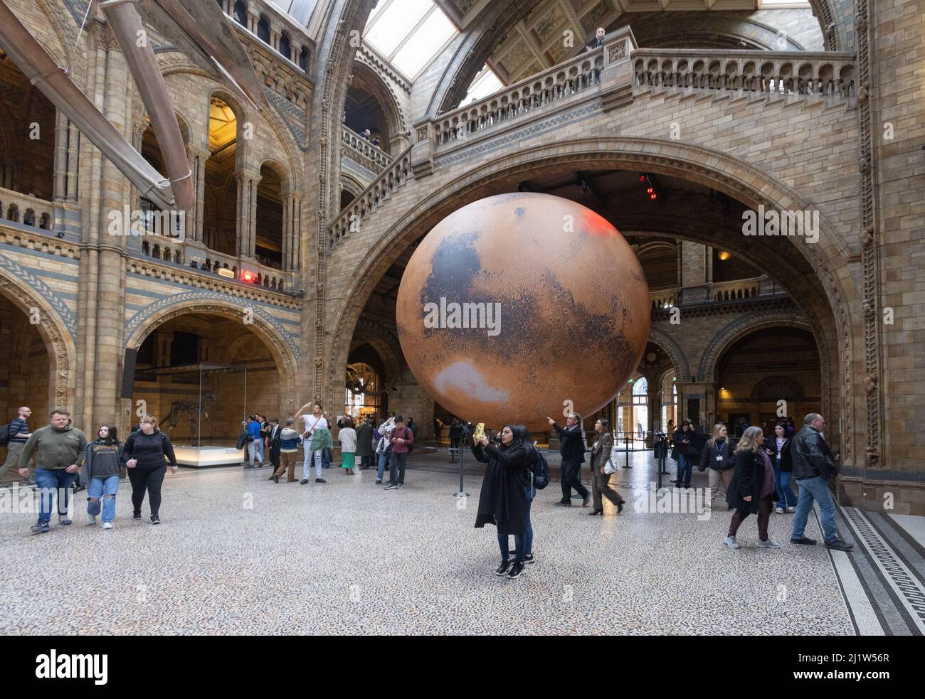 Luke Jerram Mars; people looking at the 7 metre Art Model of Mars by ...