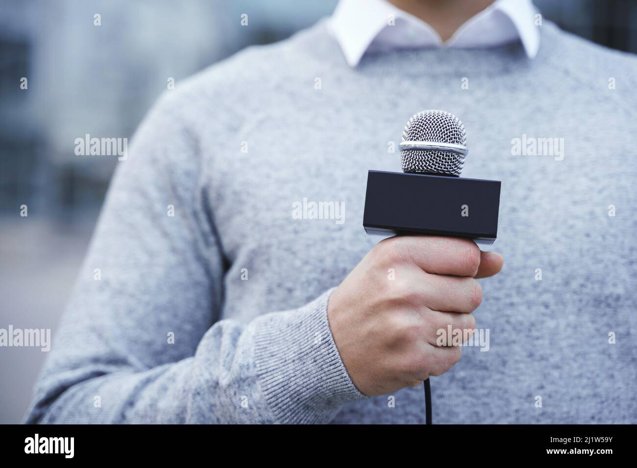 Male hand with a reporter microphone. Journalist during his work Stock ...