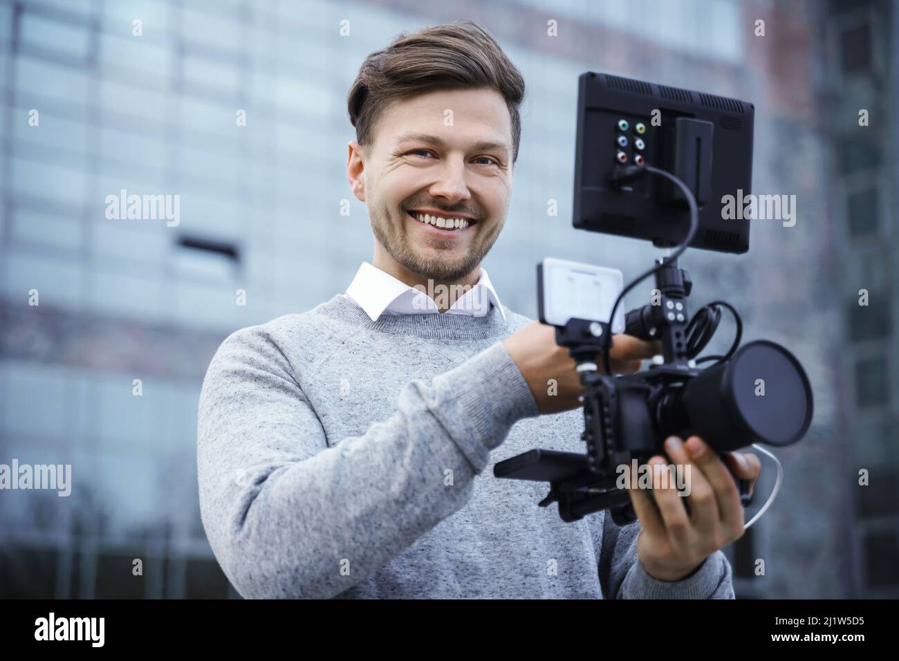 Professional videographer with a modern camera rig Stock Photo - Alamy