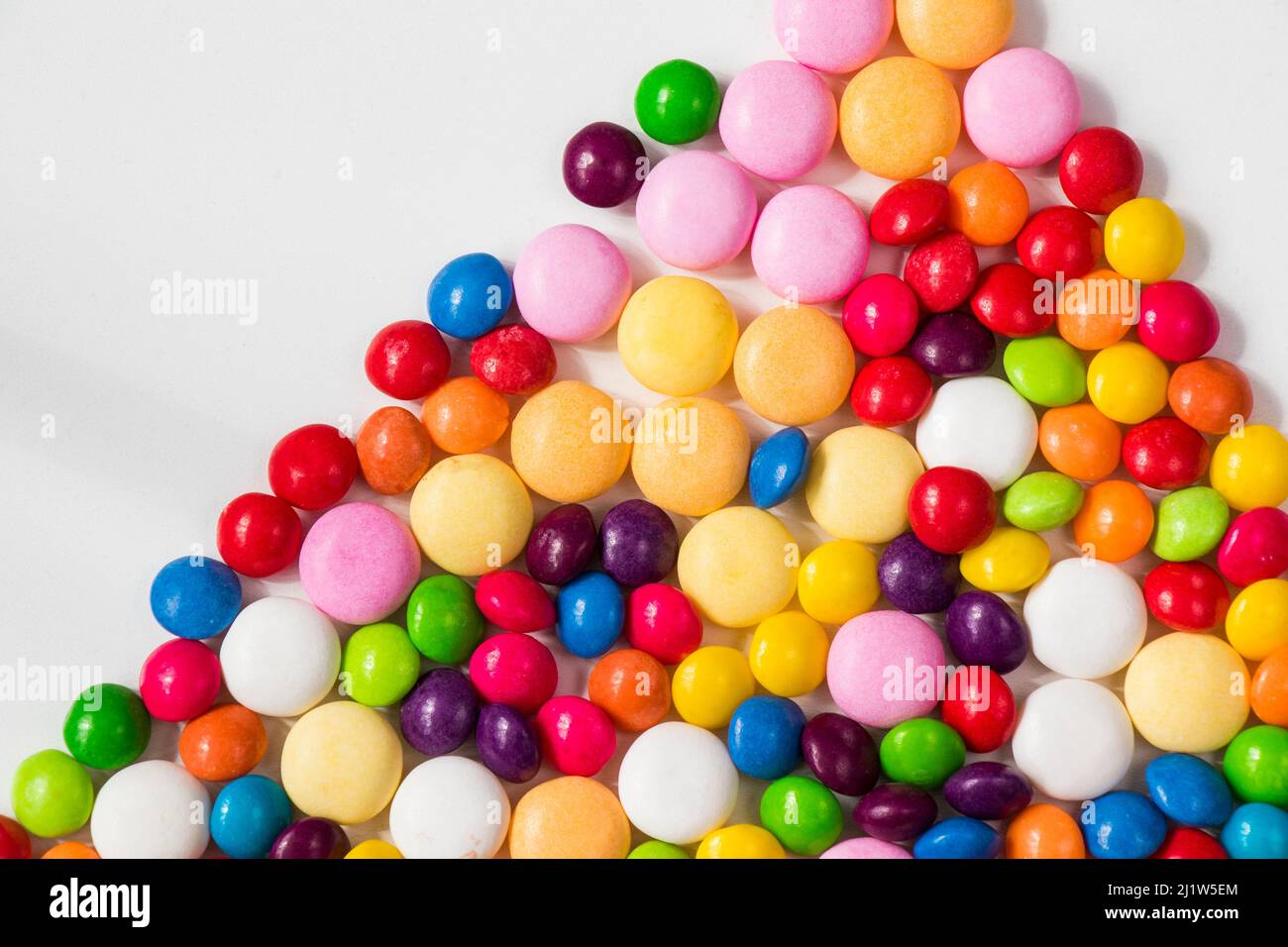 Colorful candies in the bowl, all color candies, white background Stock ...