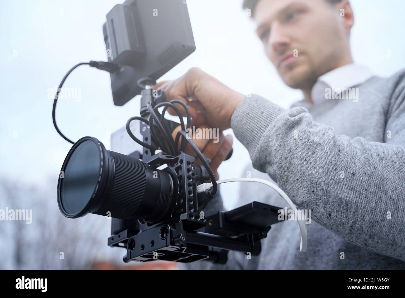 Professional videographer with a modern camera rig Stock Photo - Alamy