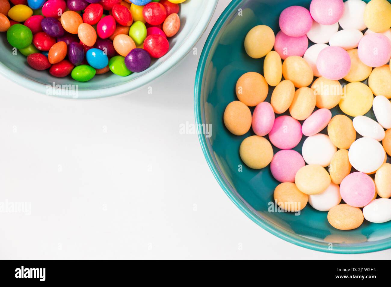 Colorful candies in the bowl, all color candies, white background Stock ...