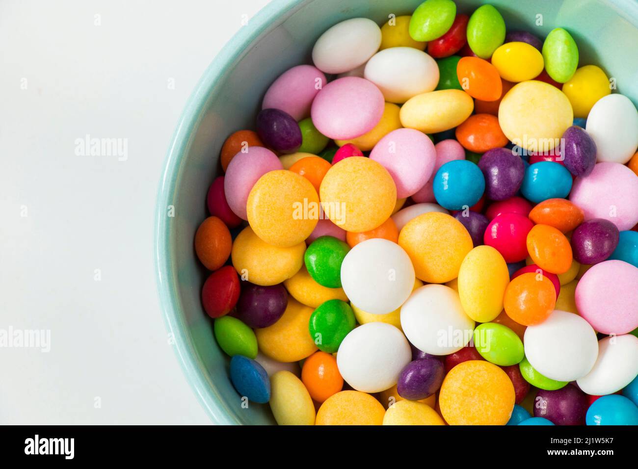 Colorful candies in the bowl, all color candies, white background Stock ...