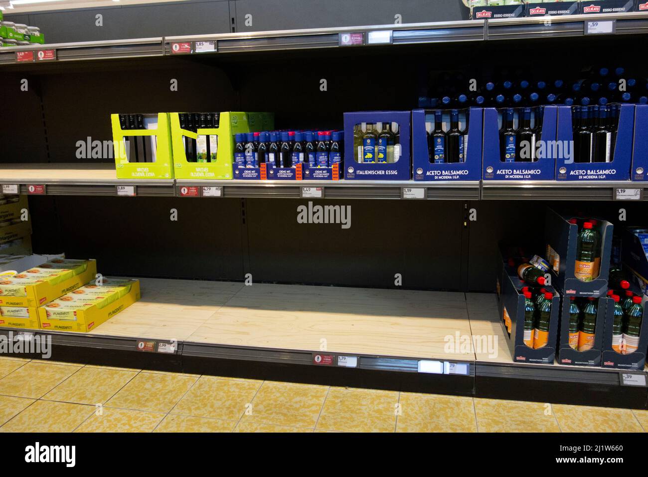 Empty supermarket shelves hoarding of edible oil hi-res stock ...