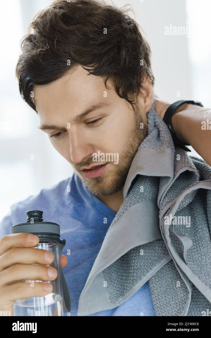 Tired sweaty man after fitness workout in the gym Stock Photo - Alamy