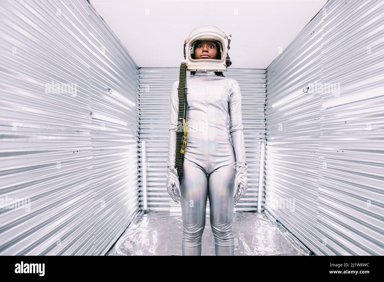 Serious professional African American female astronaut in helmet ...