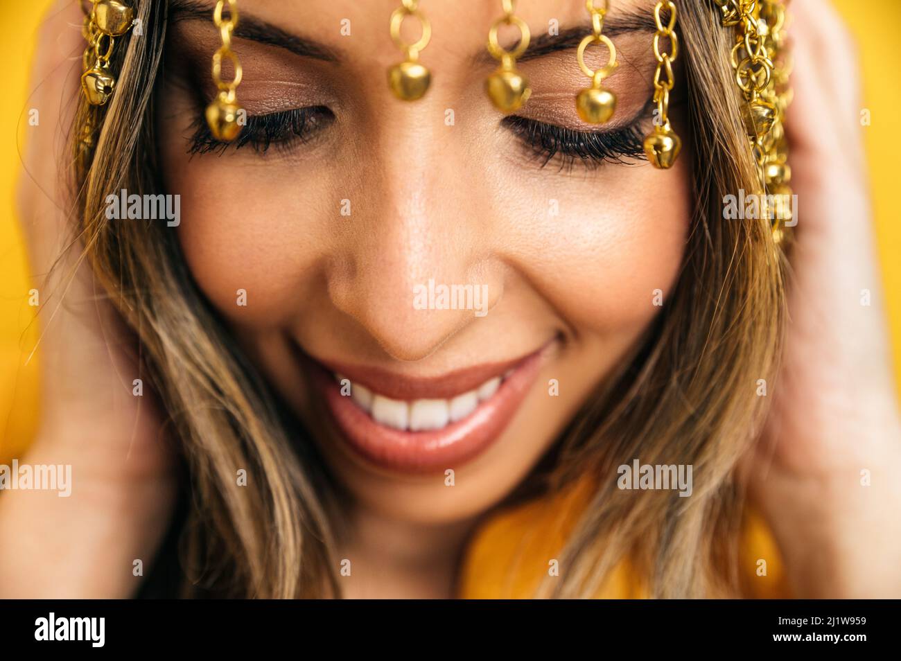 Crop optimistic Hispanic female belly dancer with stylish makeup ...