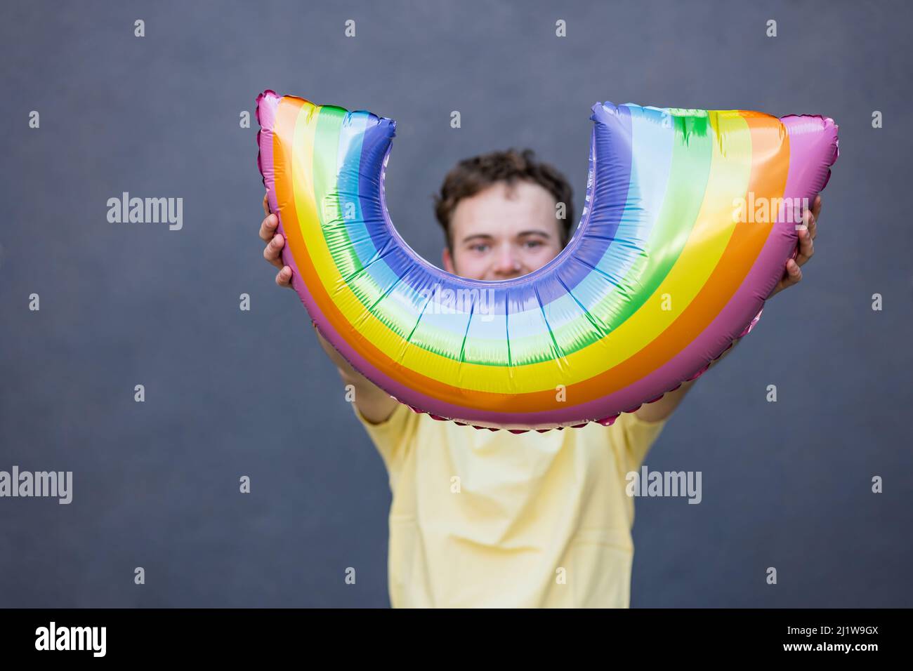 Person in casual outfit with curved figure balloon of transgender ...