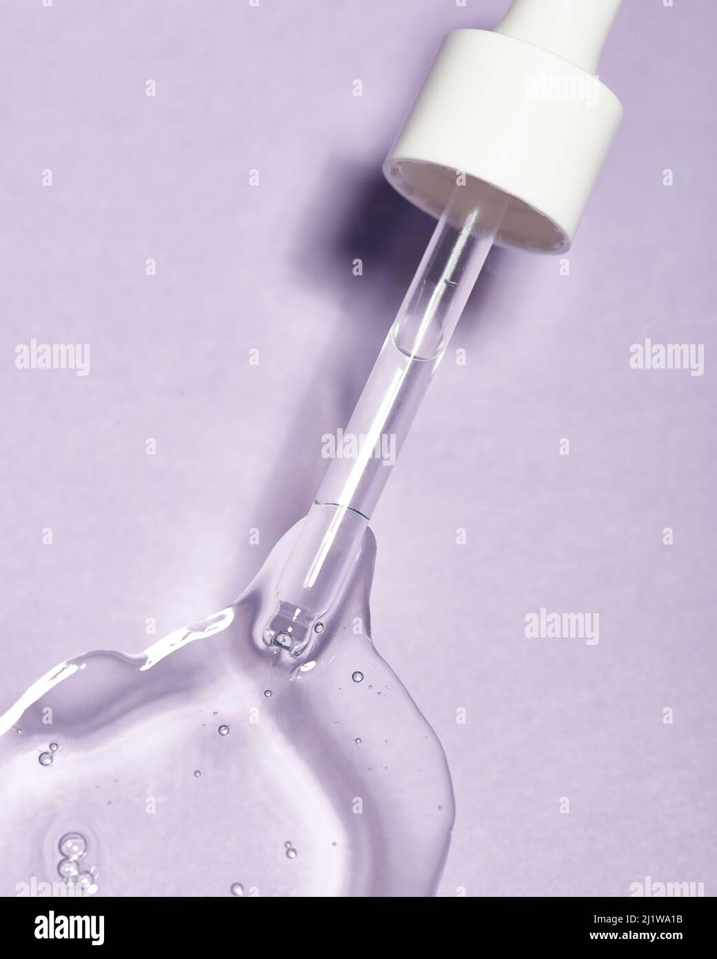 Top view of glass pipette with transparent Hyaluronic acid serum for ...