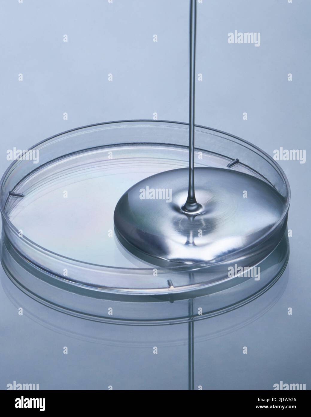 Gooey transparent Hyaluronic acid for skin care pouring into round ...