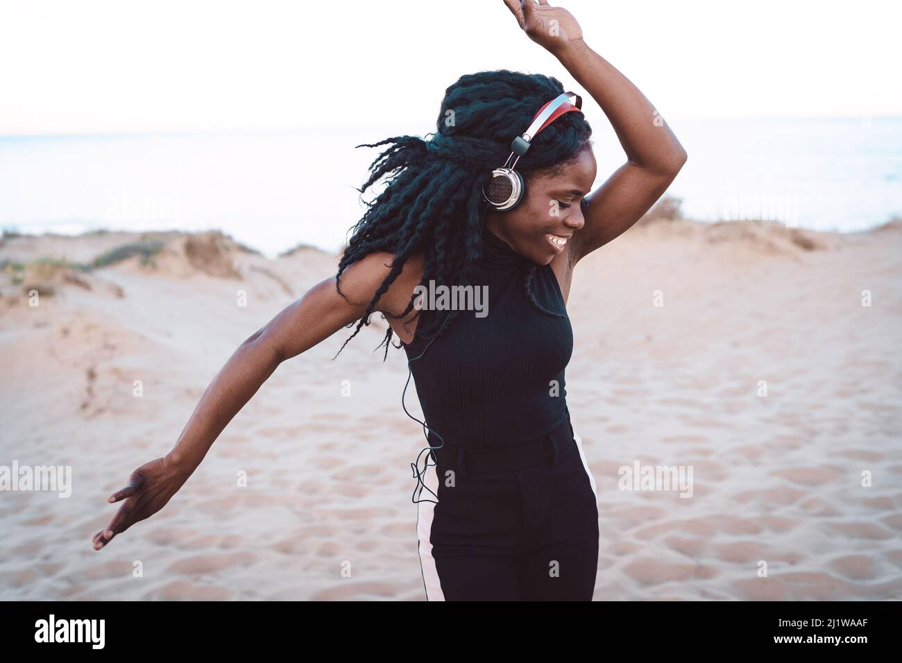 Optimistic dance african woman hi-res stock photography and images - Alamy
