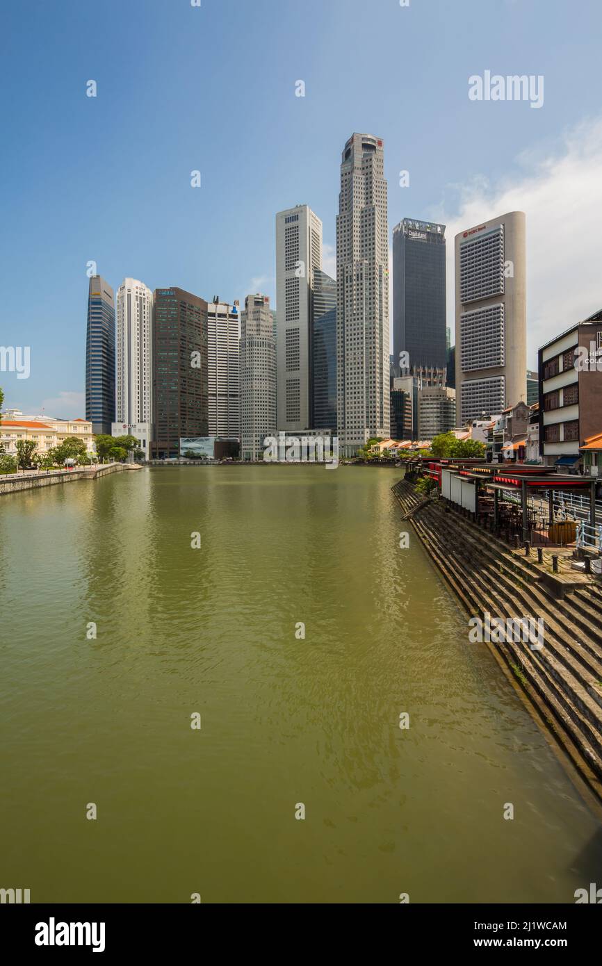 Vertical view of Singapore river, background is erected skyscrapers ...