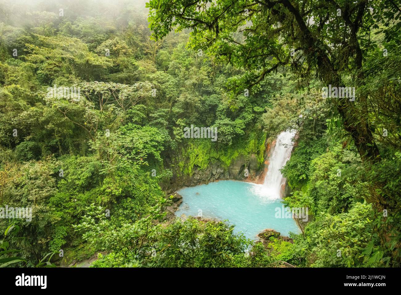 View of the Rio Celeste waterfall, tropical rainforest of Tenorio ...