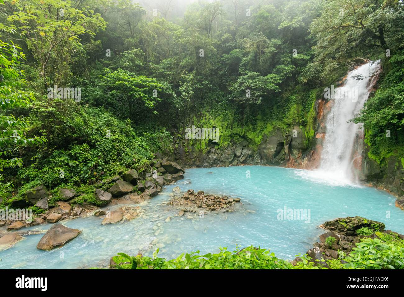 View of the Rio Celeste waterfall, tropical rainforest of Tenorio ...