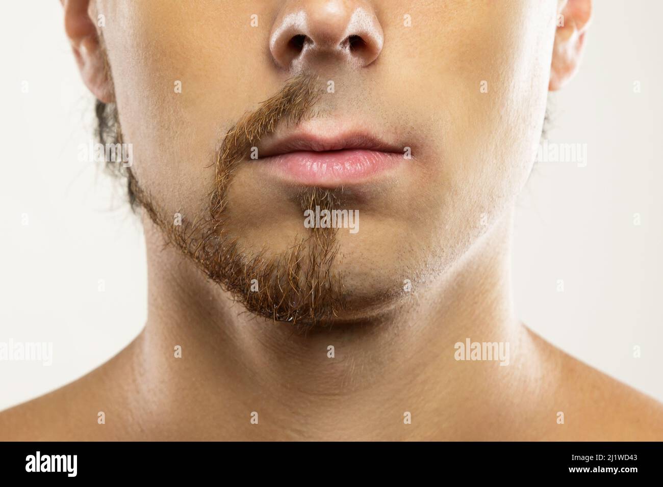 Man face with a partially shaved beard Stock Photo - Alamy