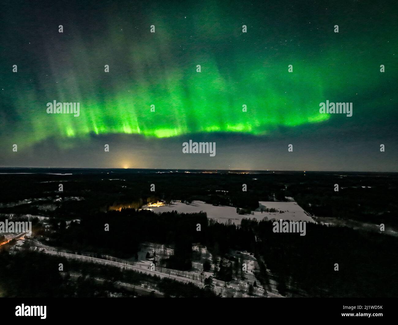 Aerial view of Aurora Borealis, Northern lights above the countyside of ...