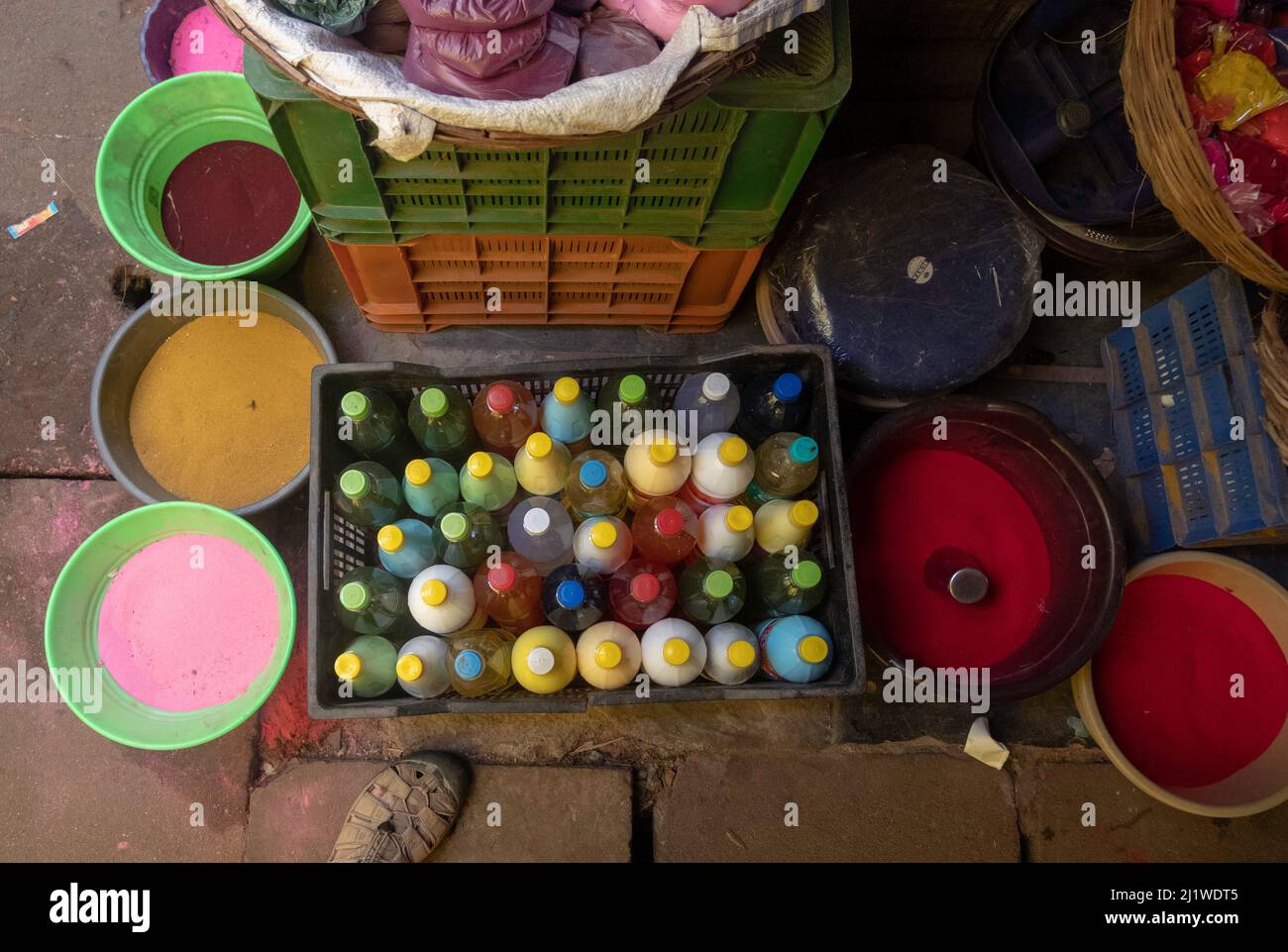 a stall selling Holi paints and dyes at an Indian Market. Photographed ...