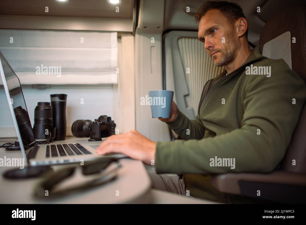 Caucasian Men in His 40s Working on His Laptop Computer While Traveling ...