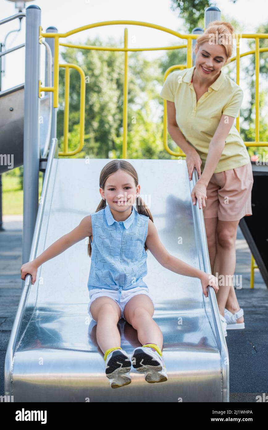 Girl on slide hi-res stock photography and images - Alamy