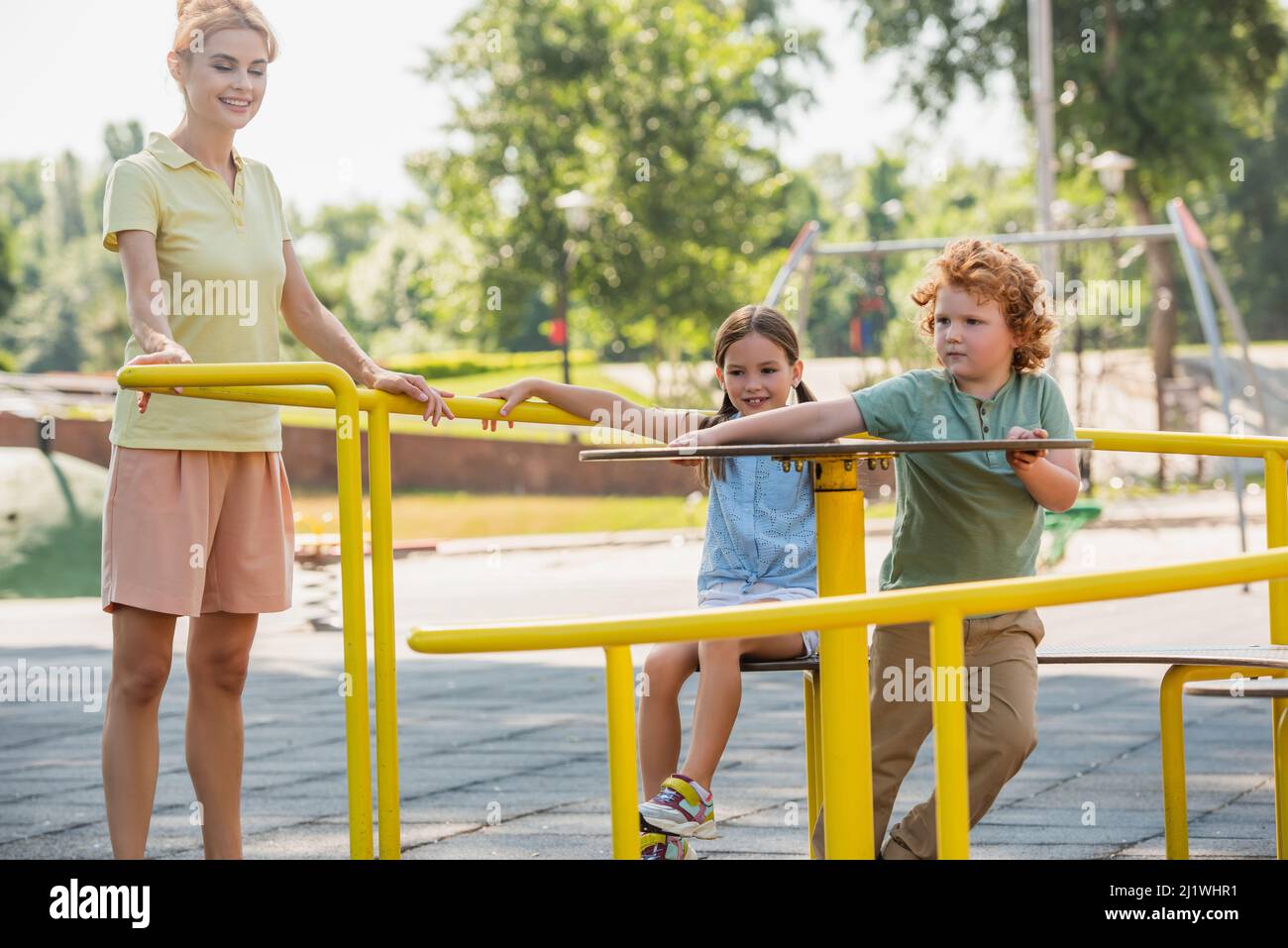 Family on carousel in amusement hi-res stock photography and images - Alamy