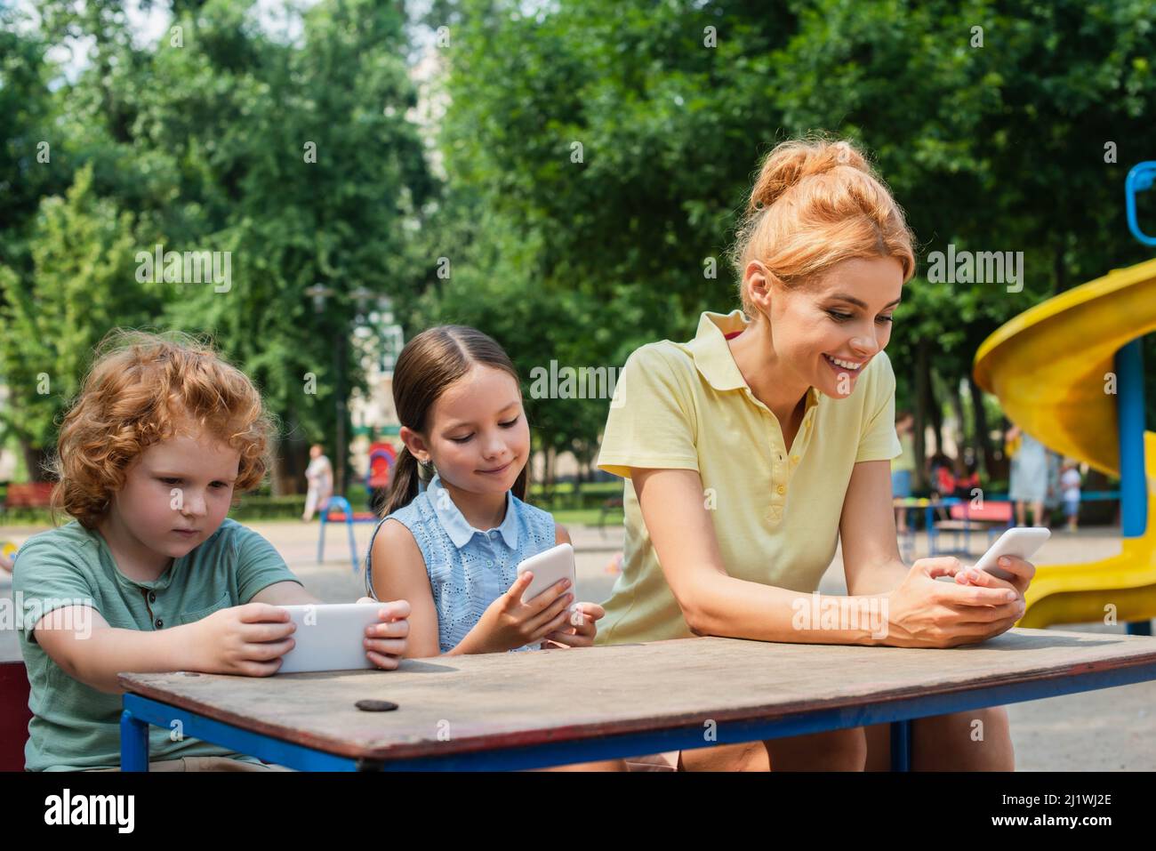 Kids using playground hi-res stock photography and images - Alamy