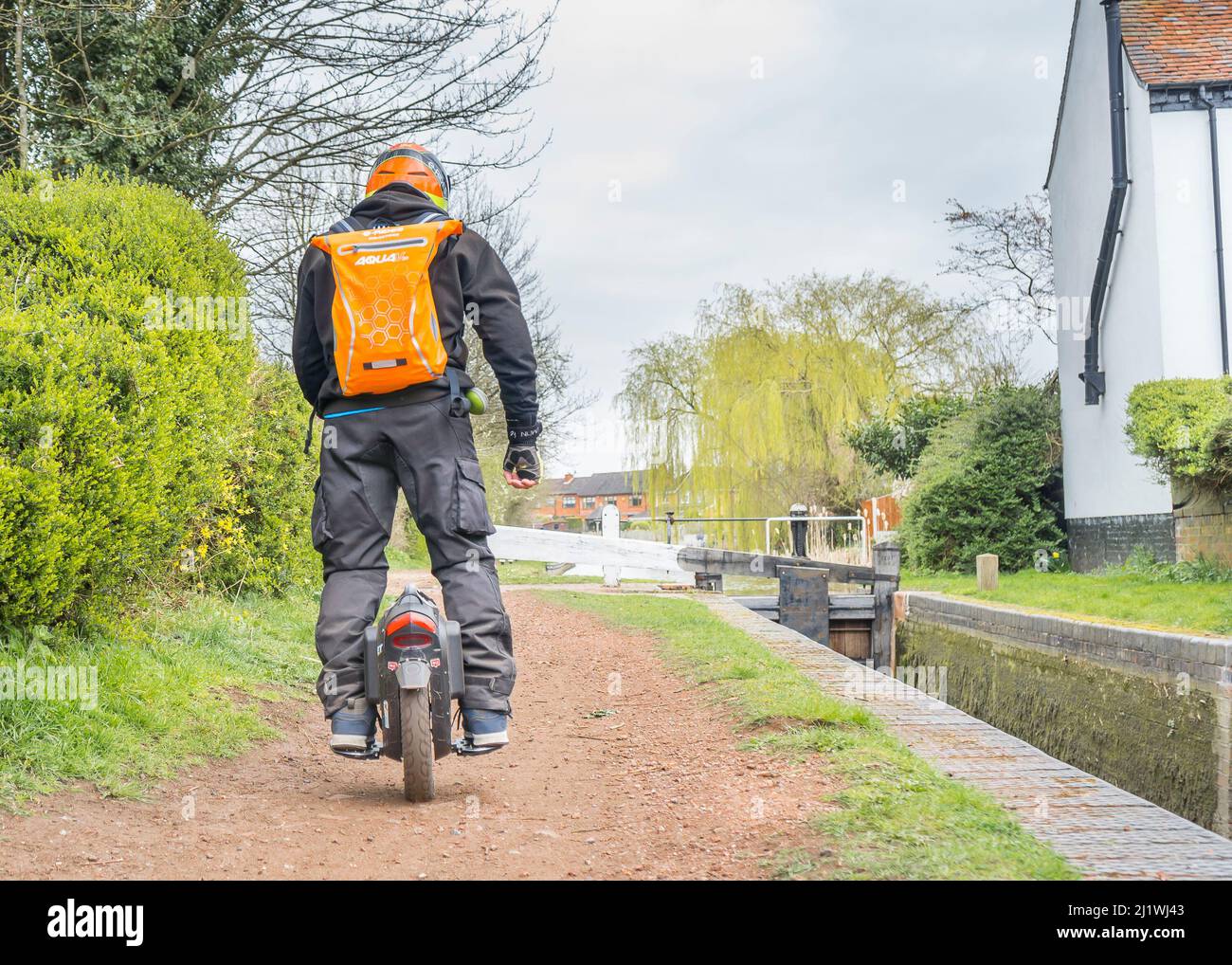 Man riding unicycle hi-res stock photography and images - Alamy