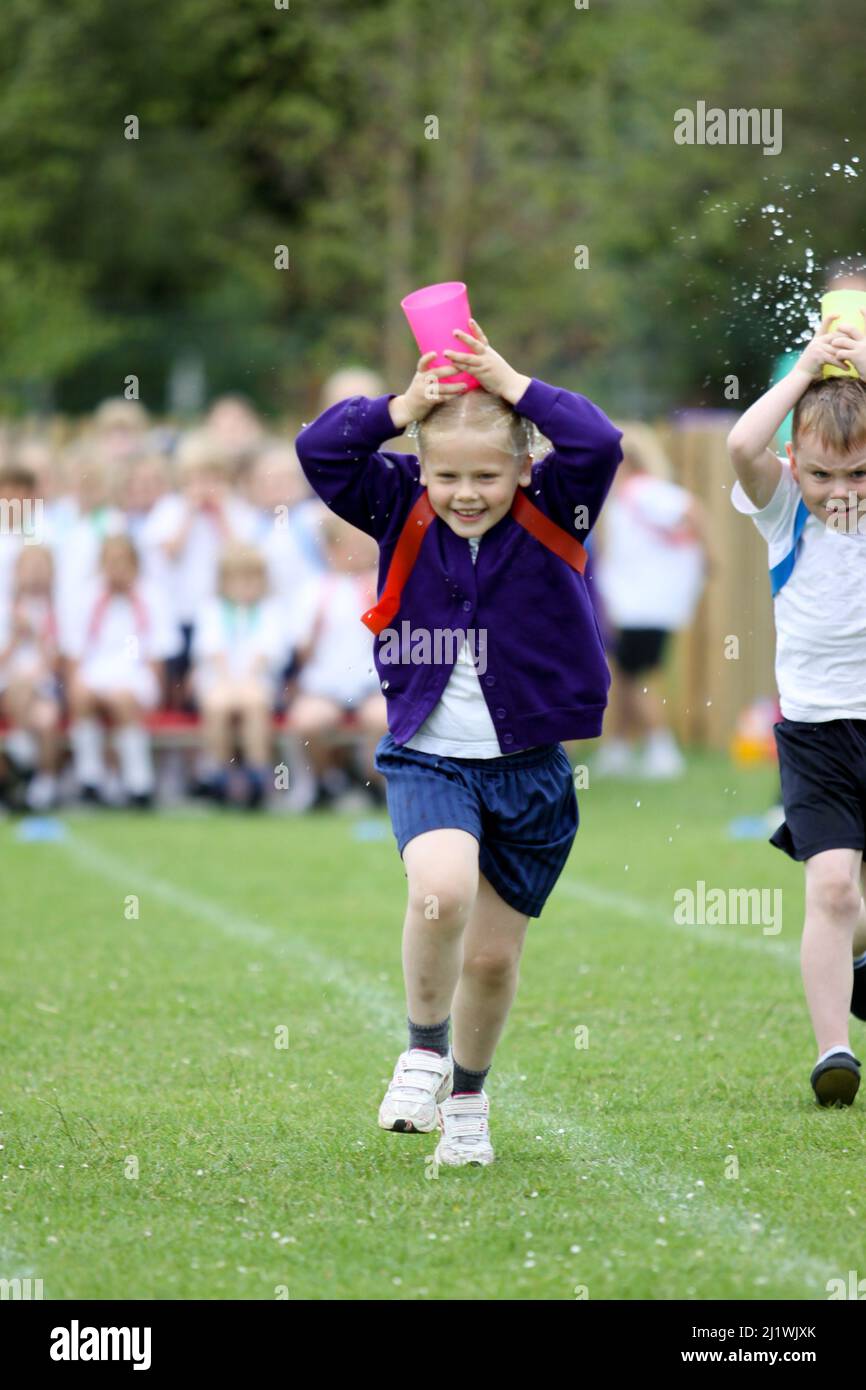 Running races at primary school sportsday Stock Photo - Alamy