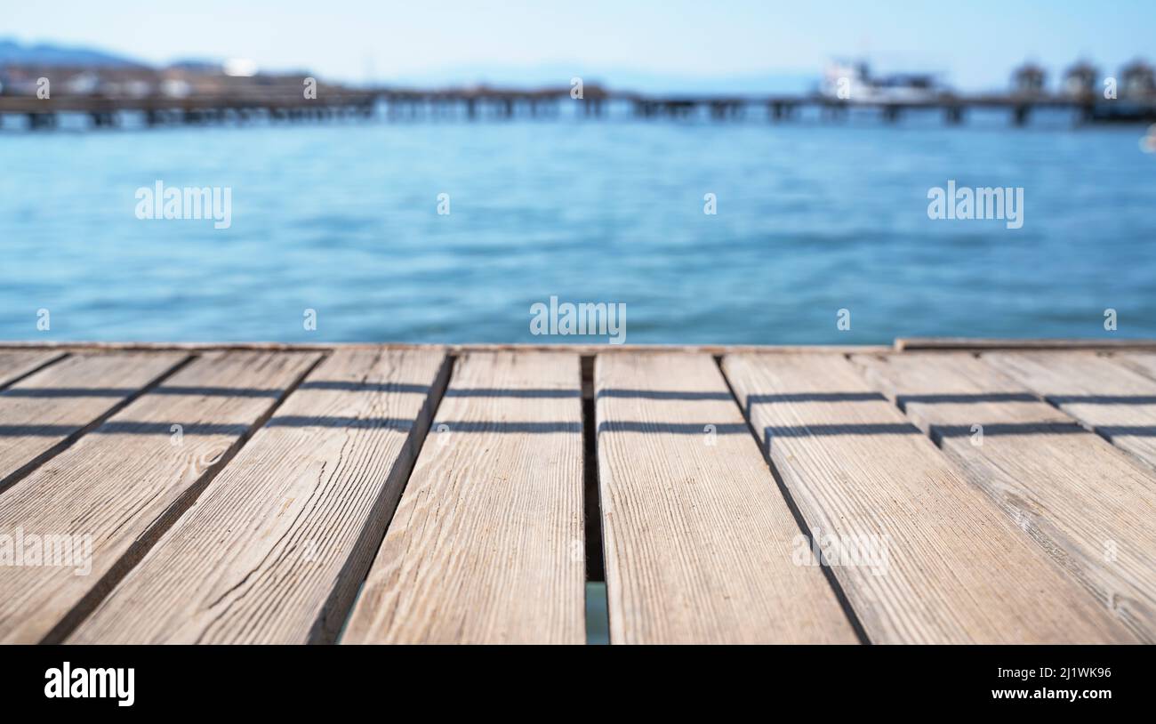 Empty wooden deck with the sea in the background Stock Photo - Alamy