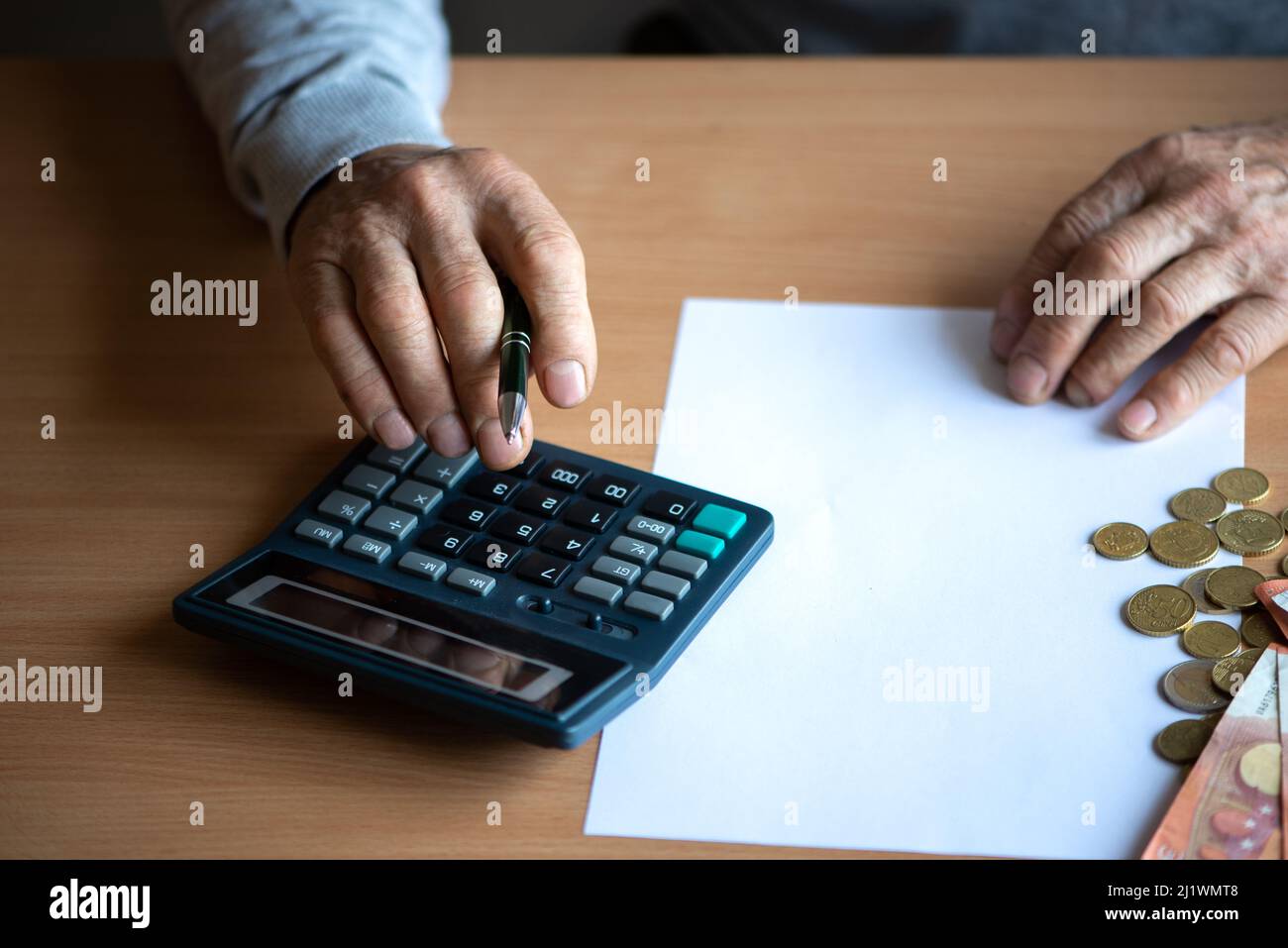 Man with calculator natural hi-res stock photography and images - Alamy