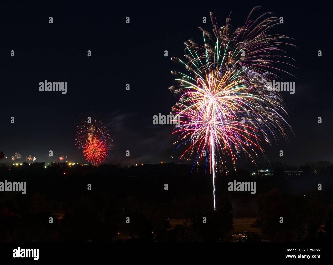 The colorful fireworks on the night sky background Stock Photo - Alamy