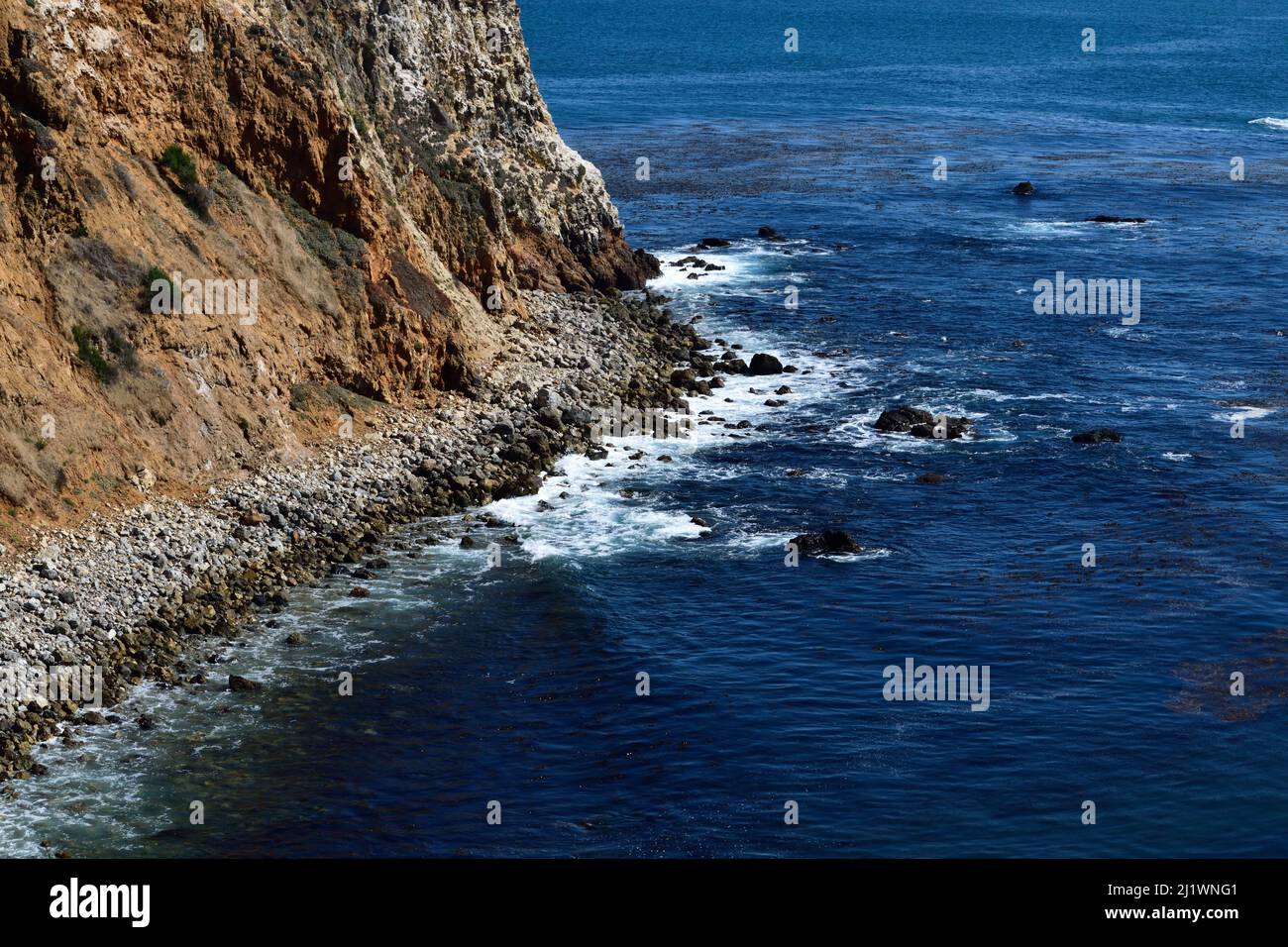 a photo of rocks going under sea Stock Photo - Alamy