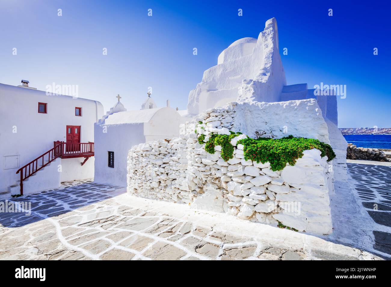 Mykonos, Greece. Whitewashed dotted alley in old city Little Venice ...